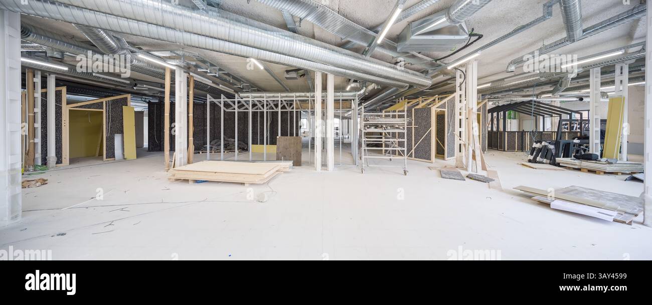 A spacious interior during its construction phase, showcasing metal ...