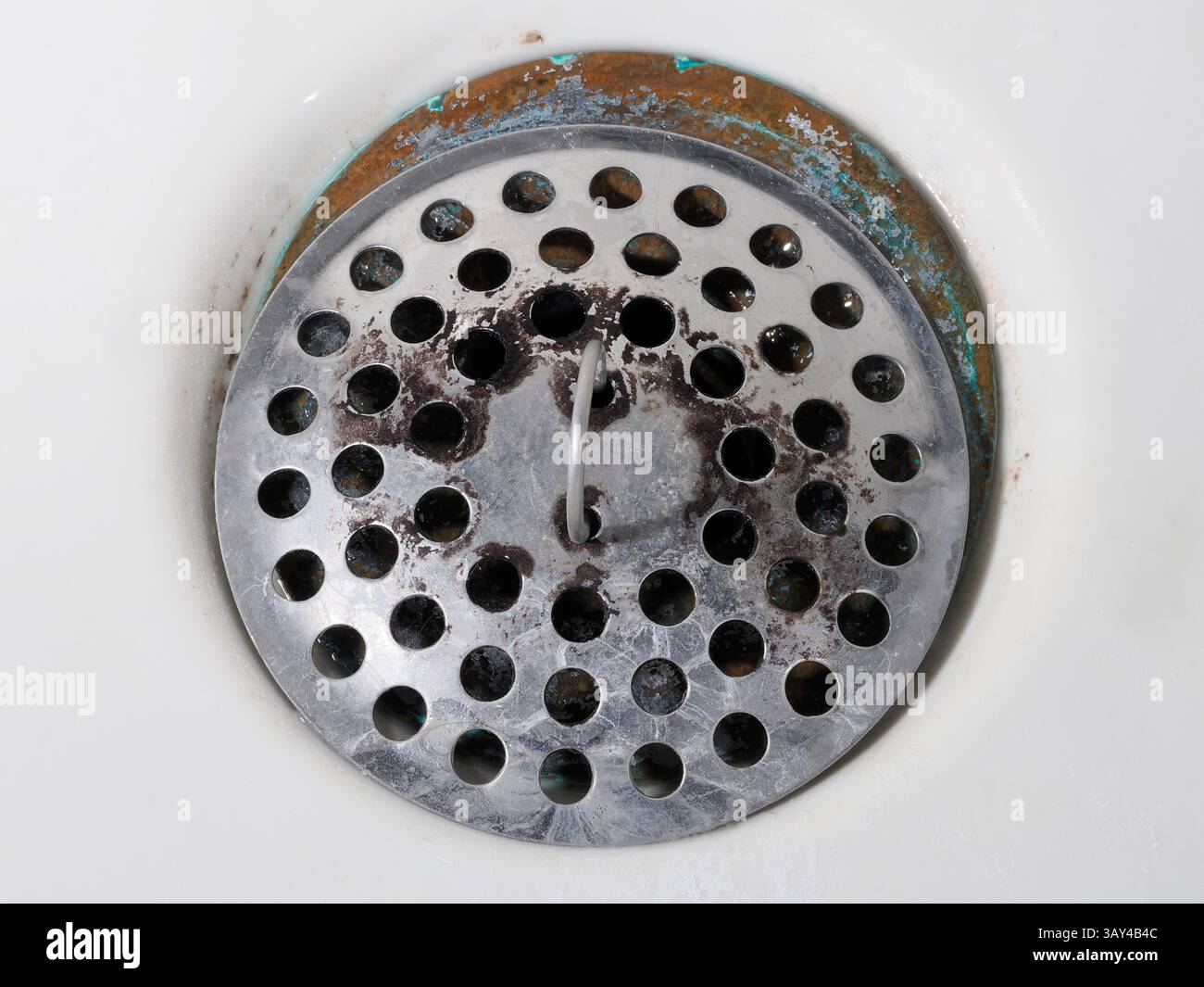 An Old metallic water filter in a ceramic washbasin Stock Photo - Alamy