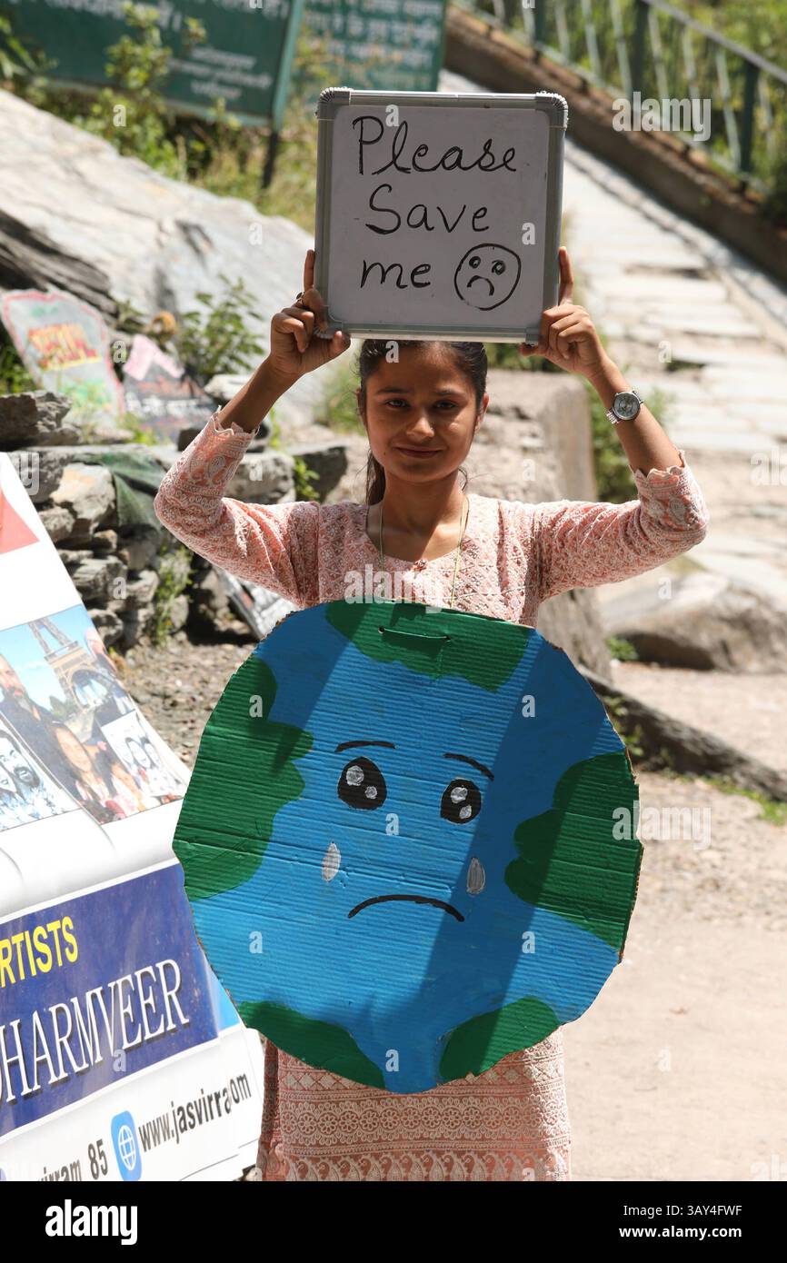 Earth Day in Dharamshala, India A volunteer from Waste Warriors , a Non ...