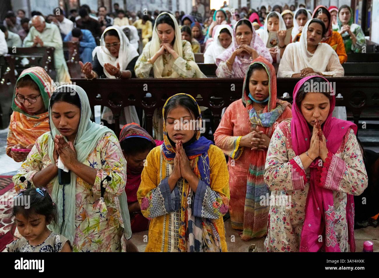 Christians attend a prayer services for late Pope Francis at the St ...