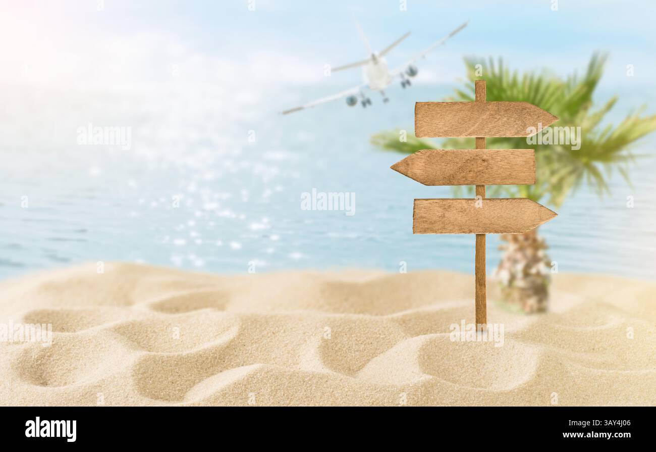 Wooden signboard with palm leaves, sun and airplane against blue sea ...