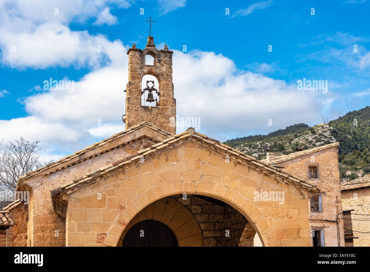 Old stone church with bell tower in the beautiful town of Beceite ...