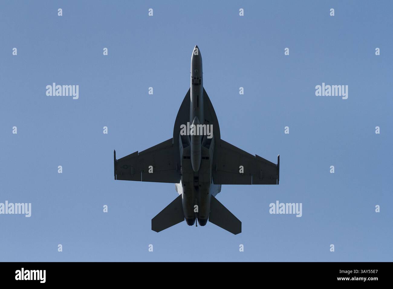 The underside of a Boeing F/A-18E Super Hornet with the US Navy flying ...