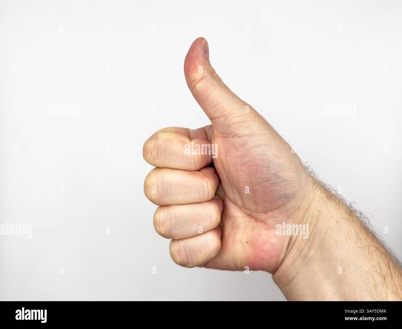 White male hand showing thumb up on white background. High quality ...