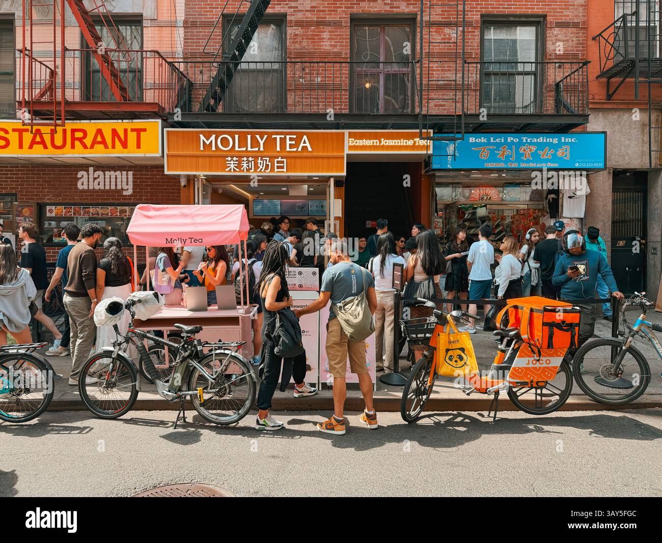 a queue outside a new branch of Shenzen-based Molly Tea in Chinatown ...