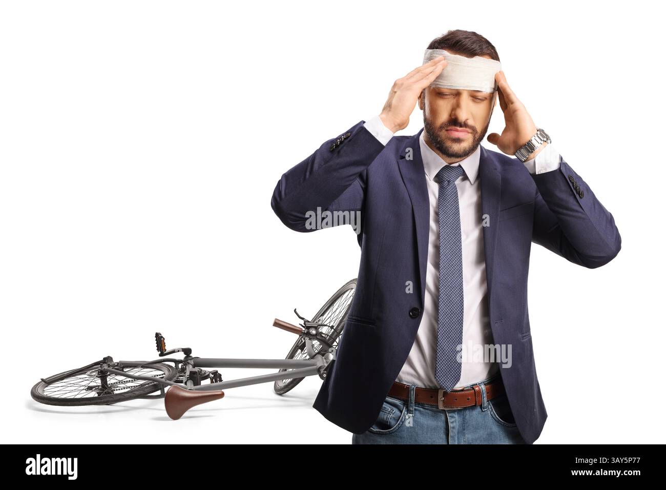 Man with a head injury from a bicycle accident wearing bandage isolated ...
