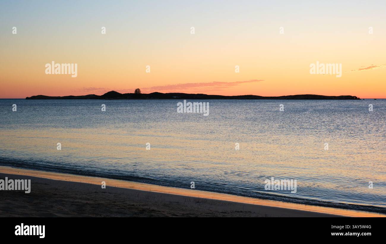 Penguin Island at sunset as seen from Shoalwater Bay in the Shoalwater ...