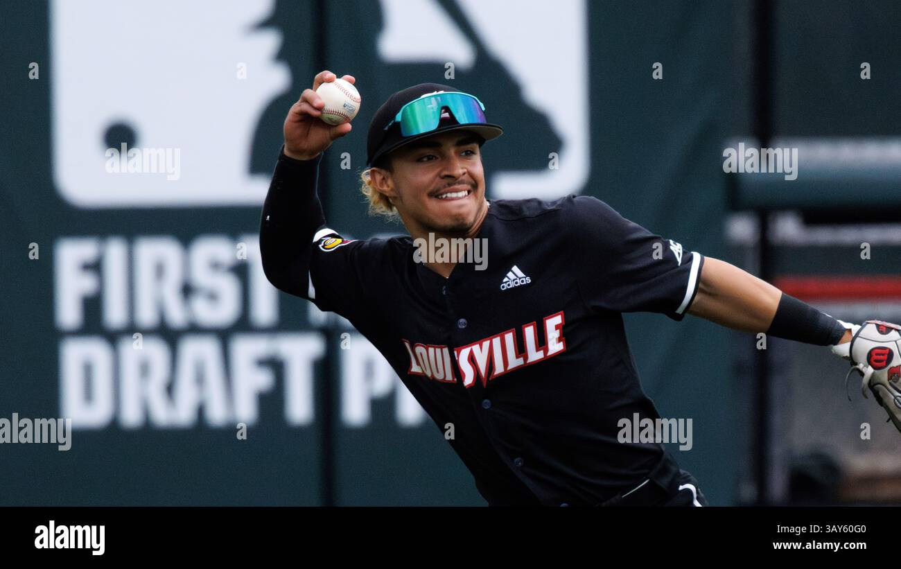 Louisville's Alex Alicea (0) makes a throw during an NCAA baseball game ...