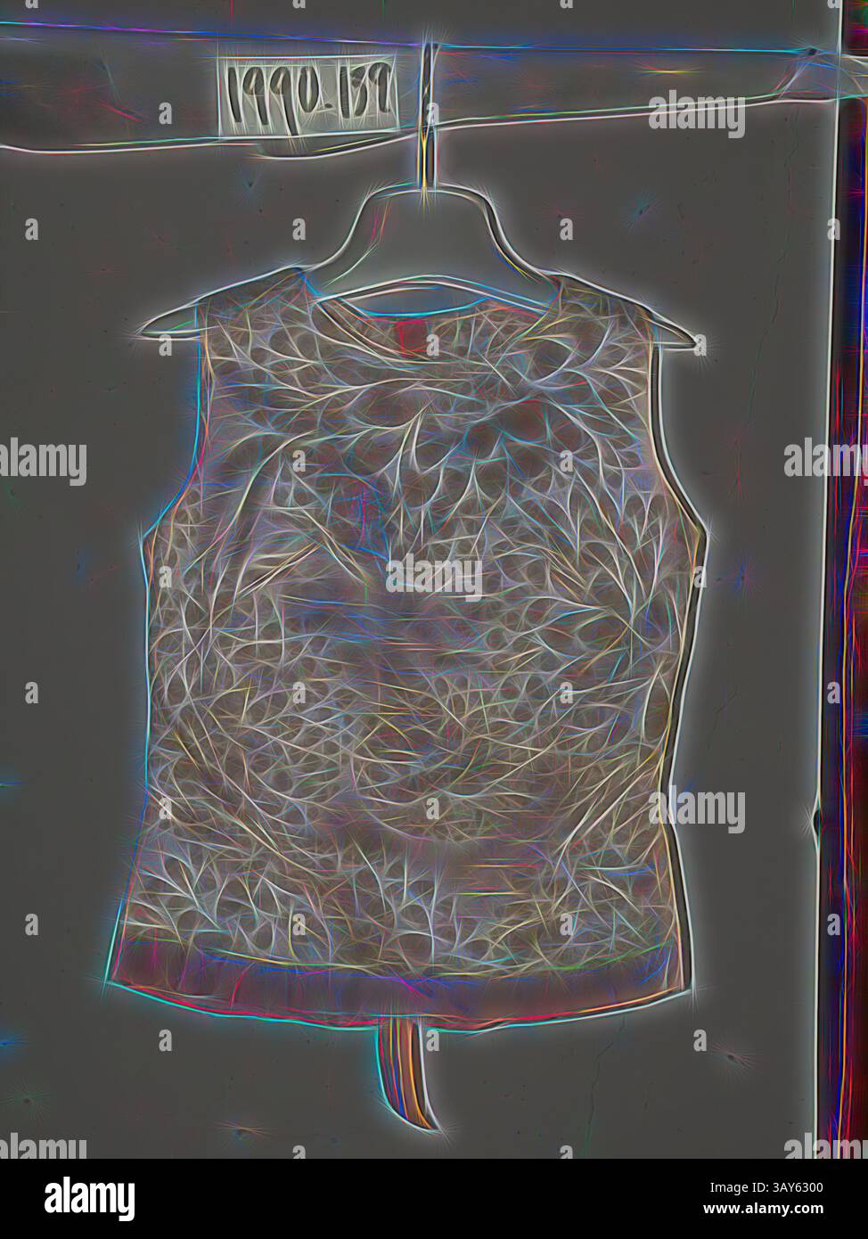 A textured garment featuring intricate leaf patterns, elegantly ...