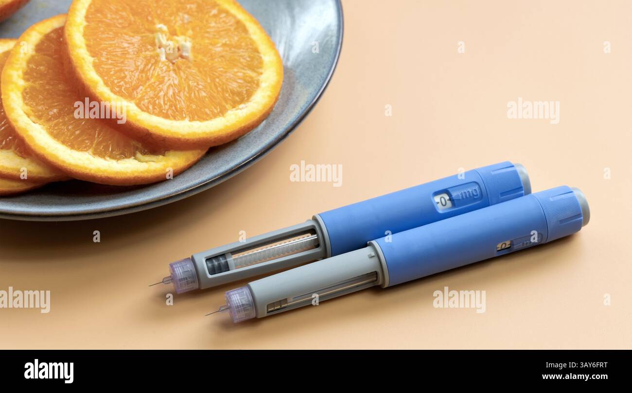 Two blue Insulin injection pen for diabetics and weight loss and plate ...