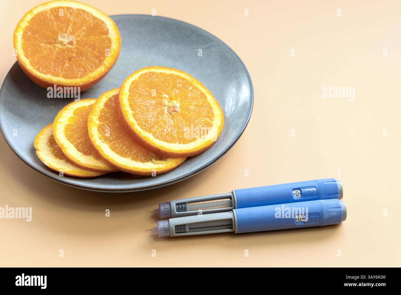 Two blue Insulin injection pen for diabetics and weight loss and plate ...