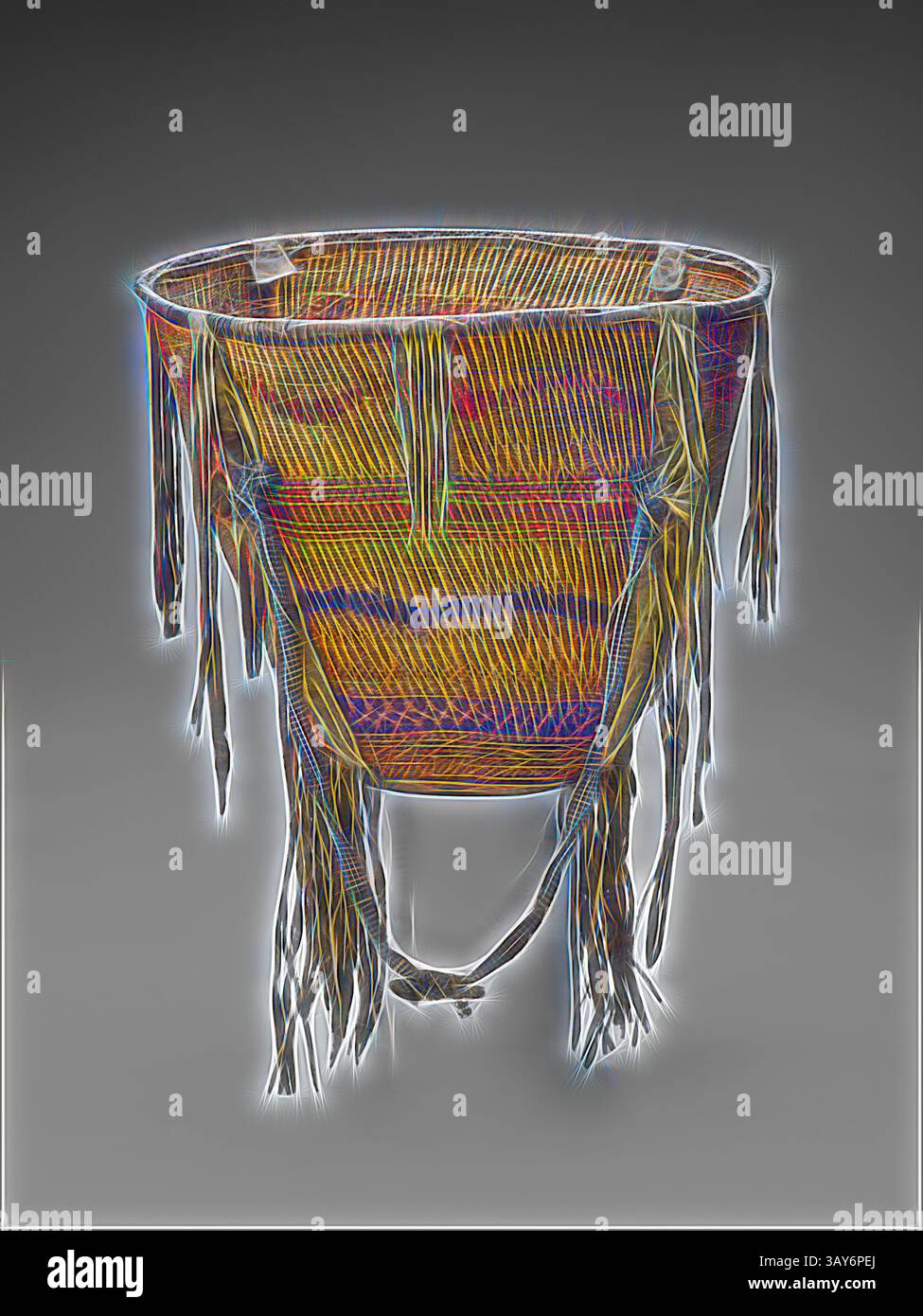 A woven basket adorned with decorative fringe, showcasing intricate ...