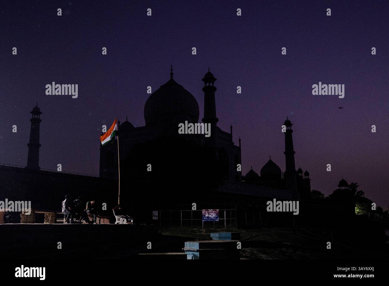 An Indian flag is flown at dusk near the Taj Mahal a day before U.S ...