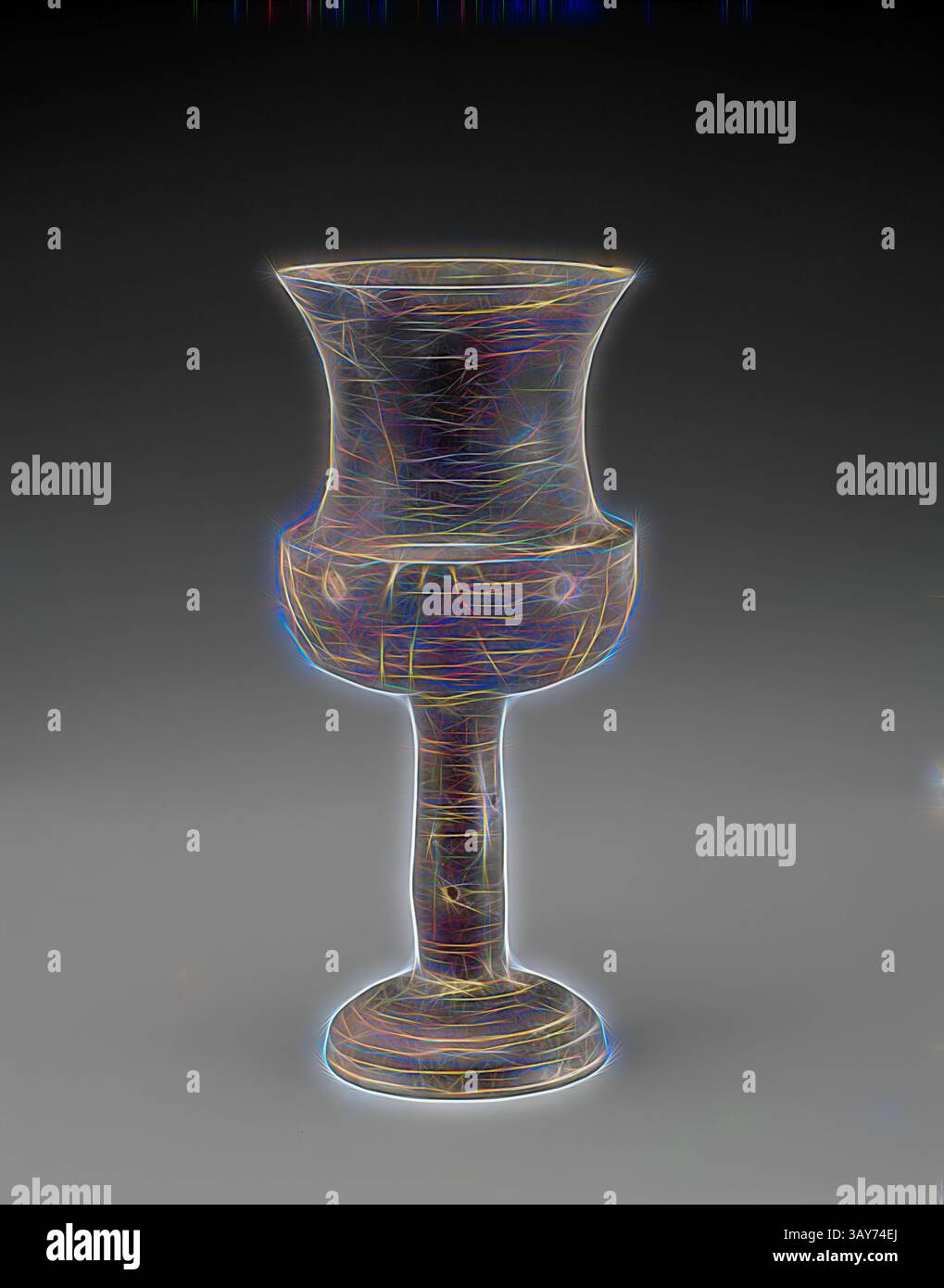 An intricately designed chalice with a textured surface, illuminated by ...