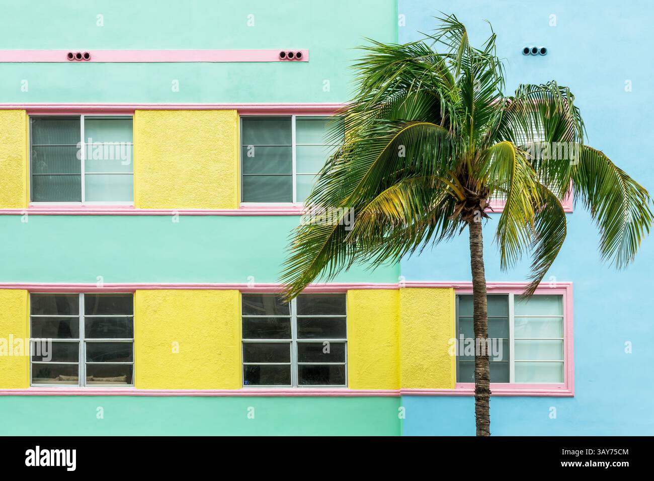 Pastel colors in Art Deco district, palm tree and Art Deco architecture ...