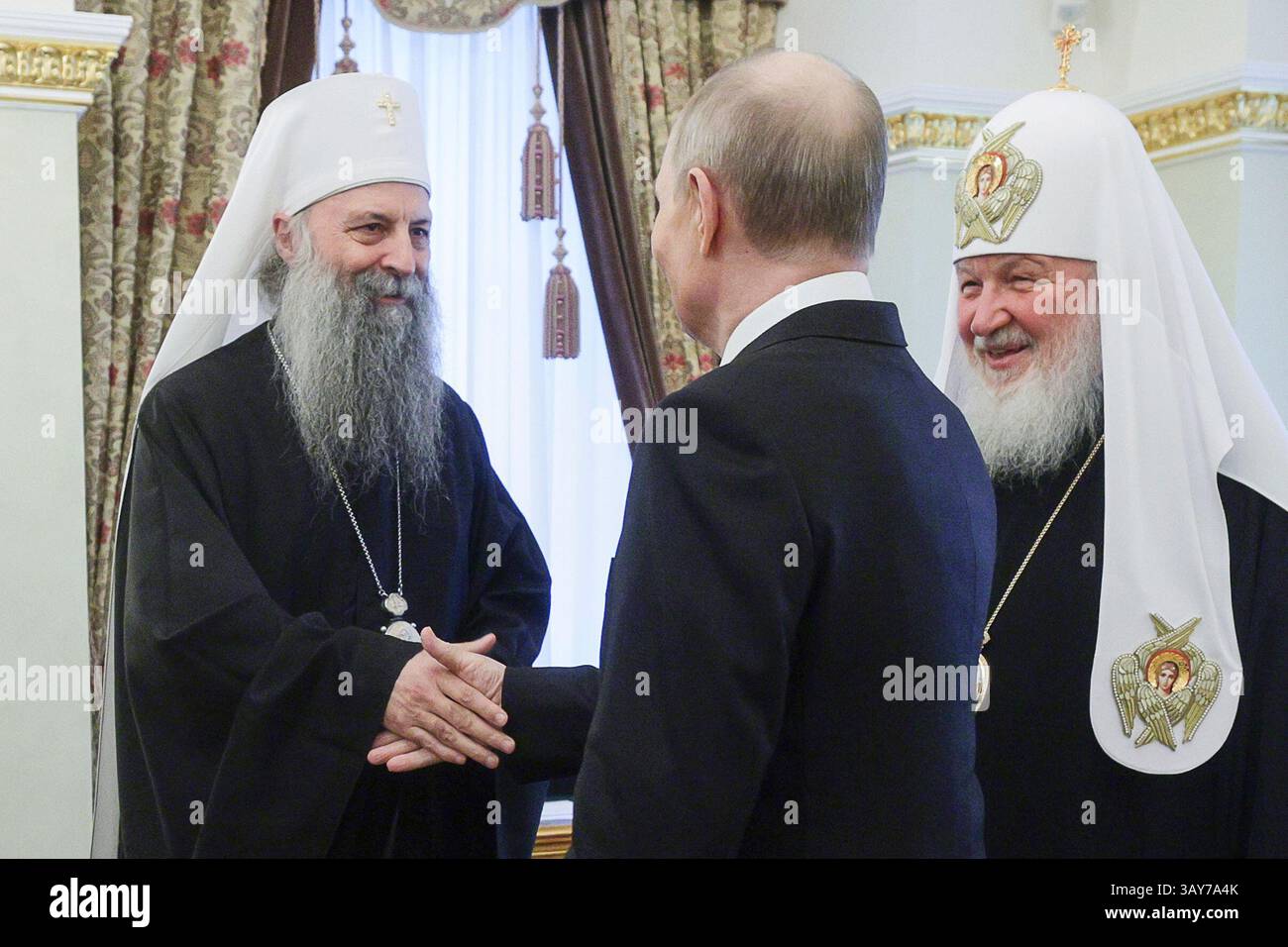 Russian President Vladimir Putin, center, shakes hands with Serbian ...