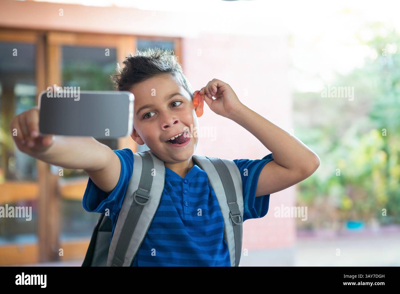 Child pulling backpack school hi-res stock photography and images - Alamy
