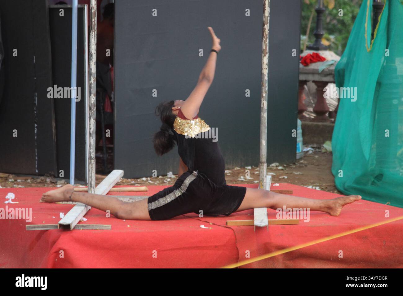 Thiruvananthapuram, India. 11th Apr, 2024. Contortionist performs ...