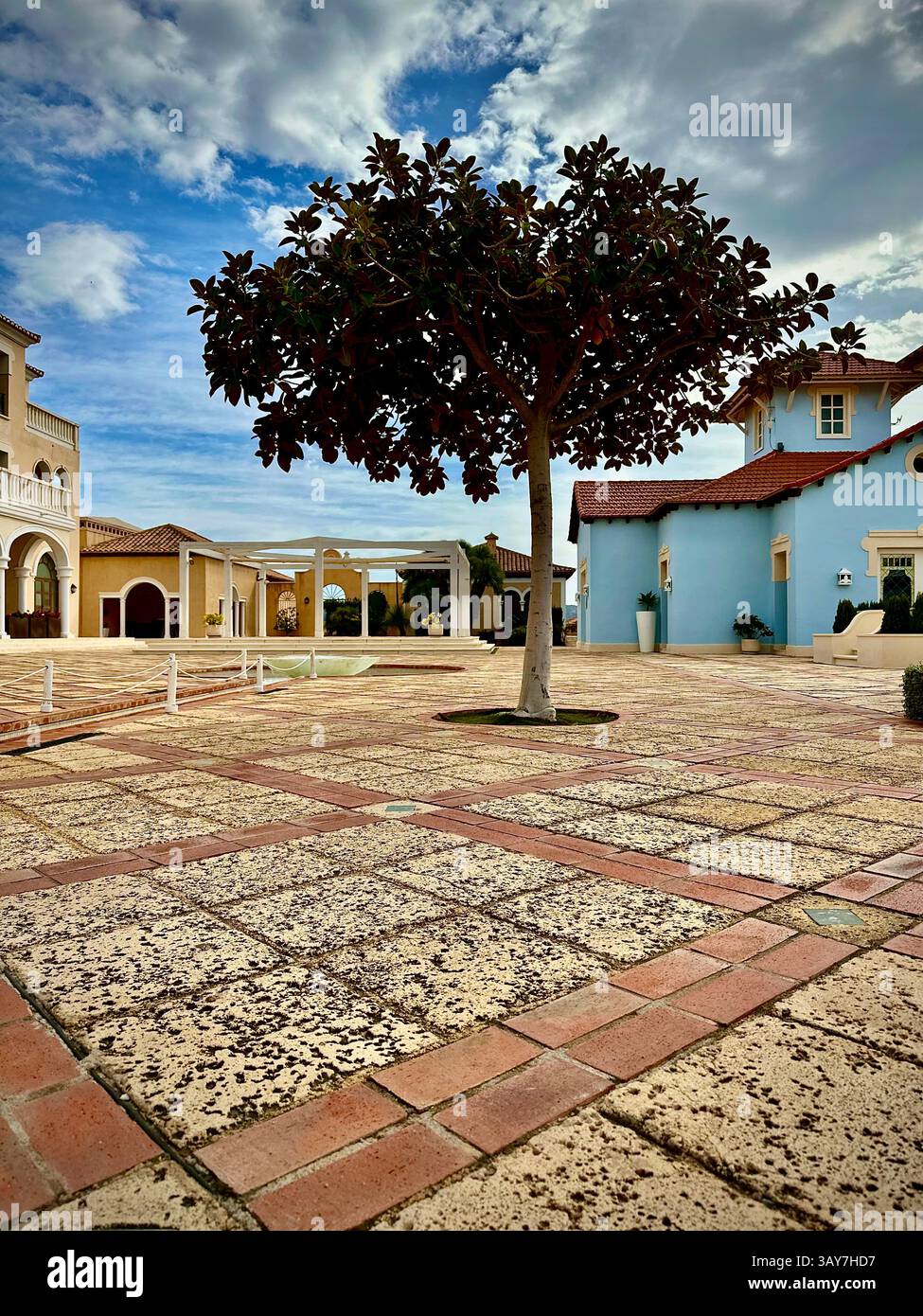 Sunny courtyard scene features hi-res stock photography and images - Alamy