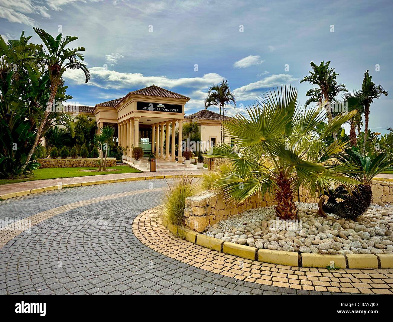This image showcases the grand entrance to a luxury golf resort ...