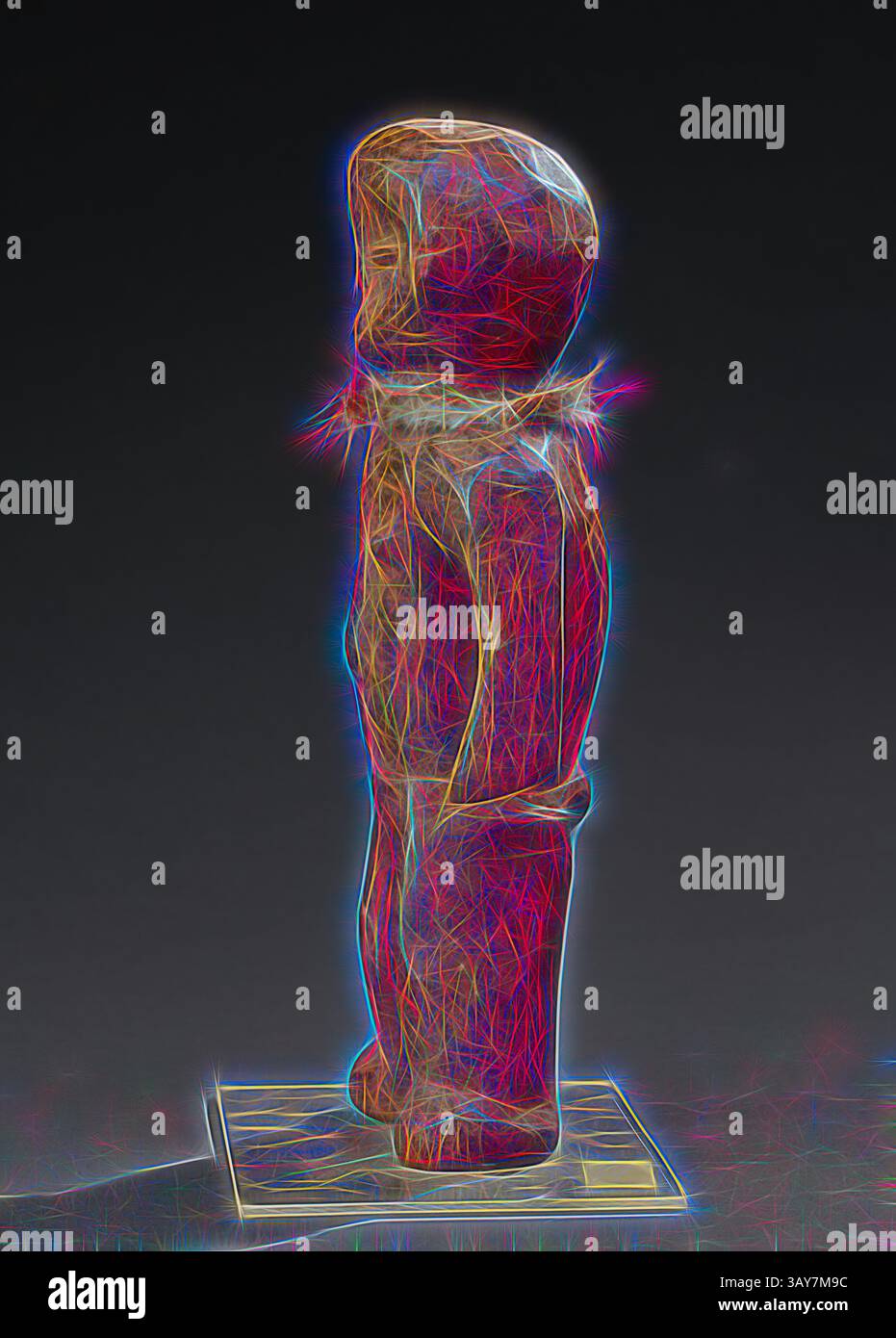 A stylized figure resembling a traditional Inuit carving stands upright ...