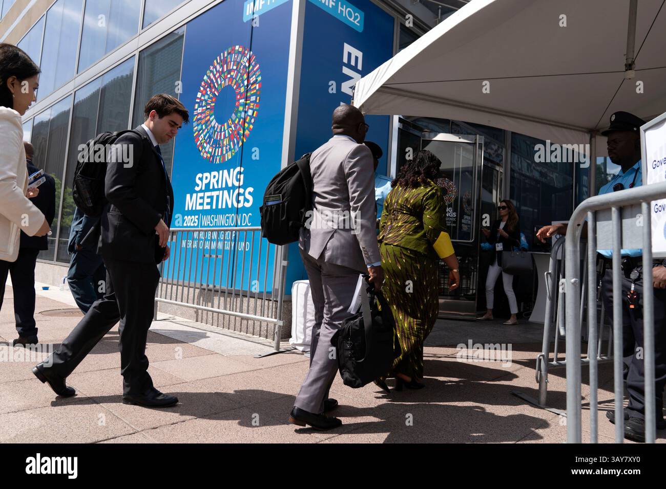 Delegates arrive to the International Monetary Fund (IMF) building ...