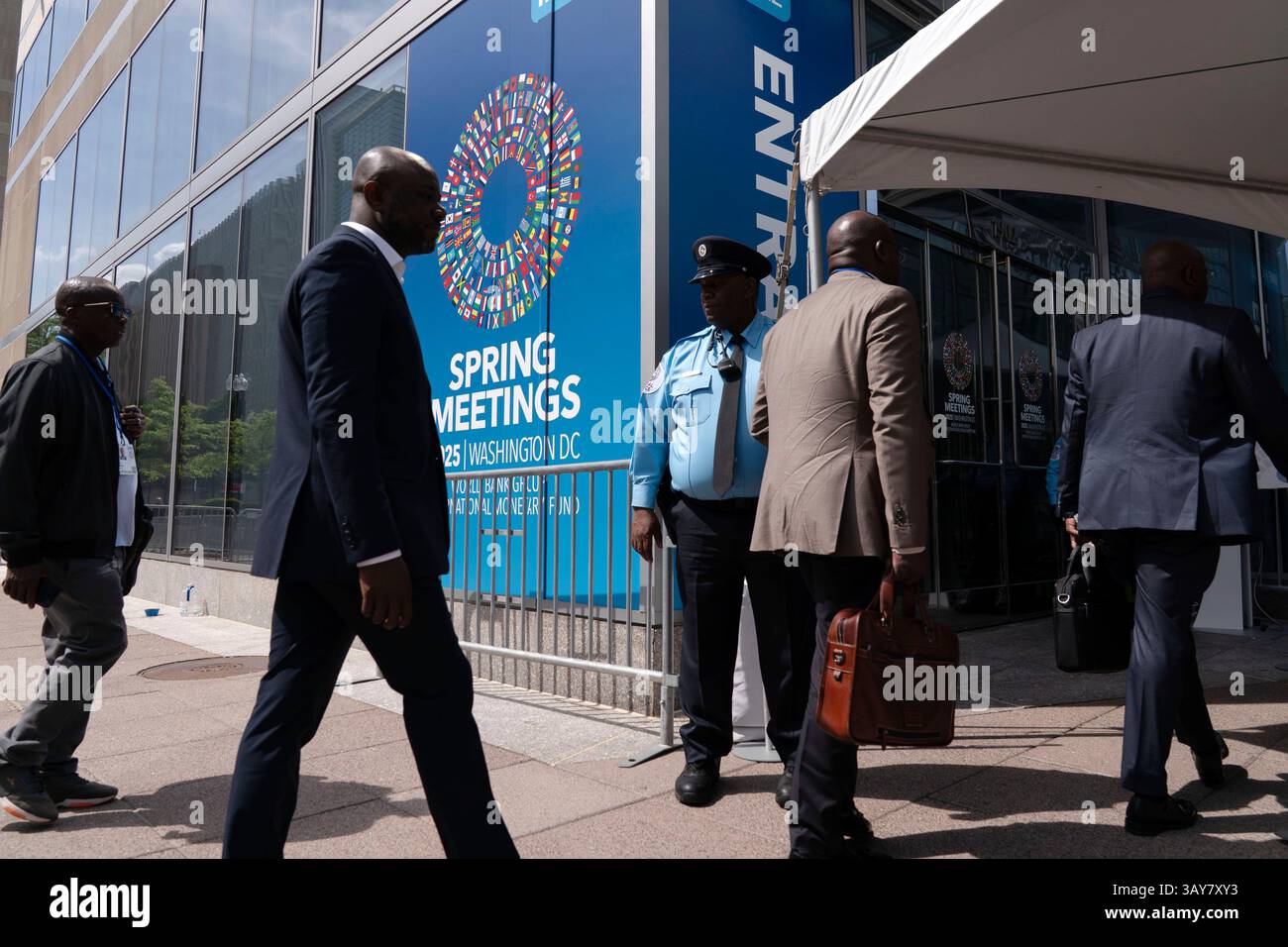 Delegates arrive to the International Monetary Fund (IMF) building ...