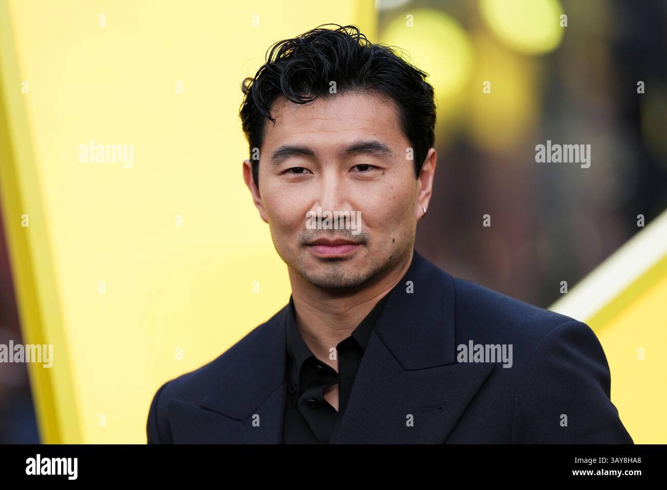 Simu Liu poses for photographers upon arrival at a screening of the ...