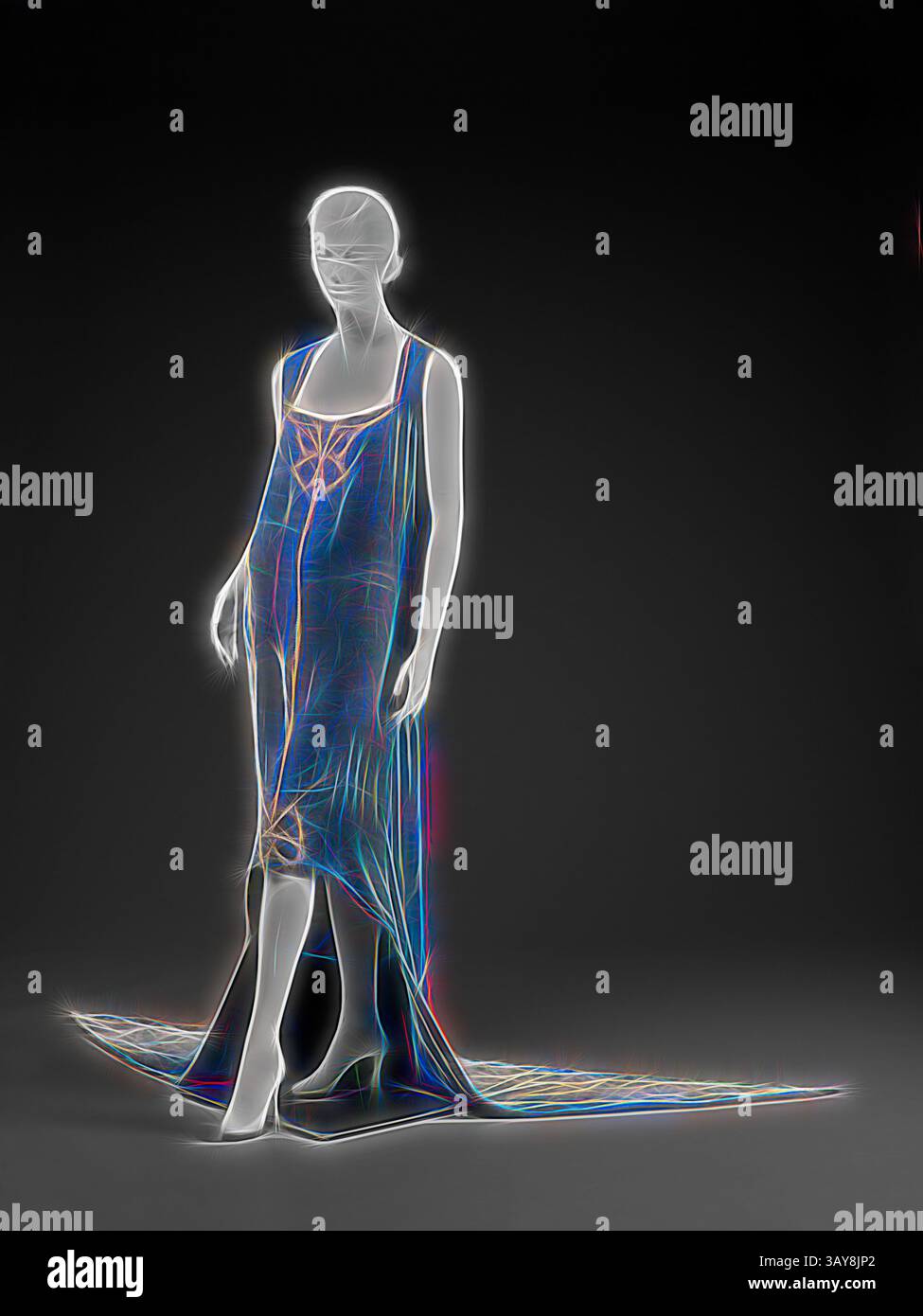 A fashion model elegantly showcases a flowing gown, featuring intricate ...