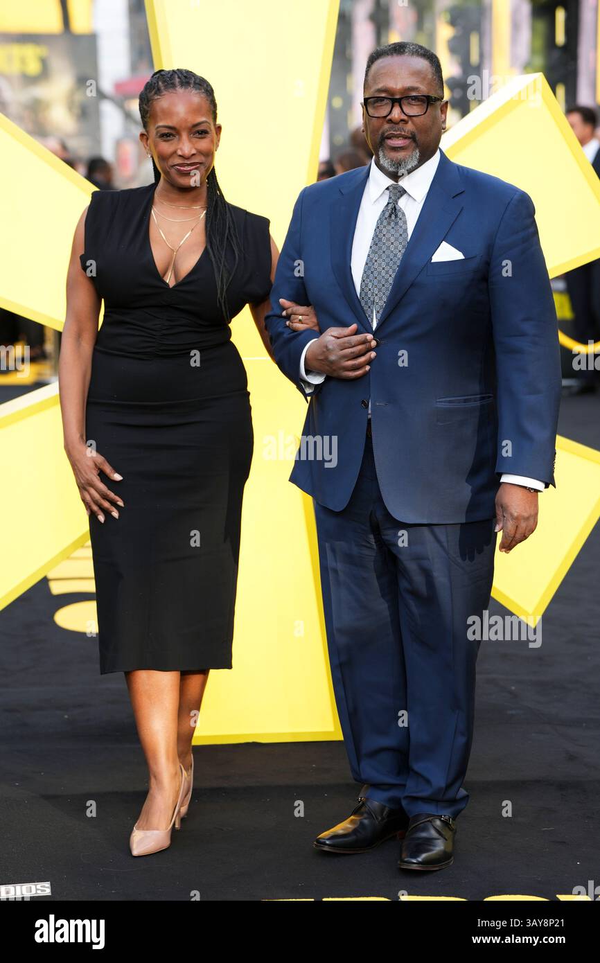 Erika Woods, left, and Wendell Pierce pose for photographers upon ...
