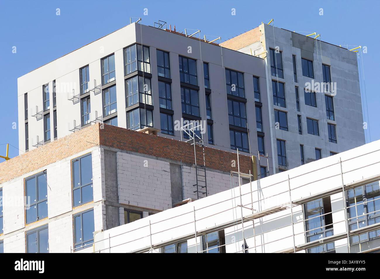 The process of insulating external walls in a multi-storey building ...