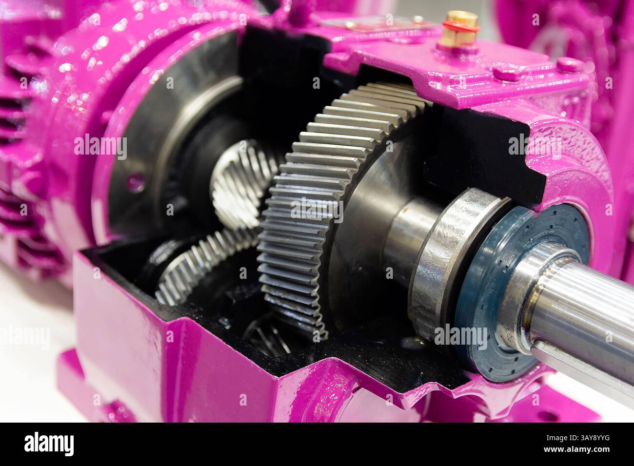 Gearbox on large electric motor at industrial equipment plant close-up ...