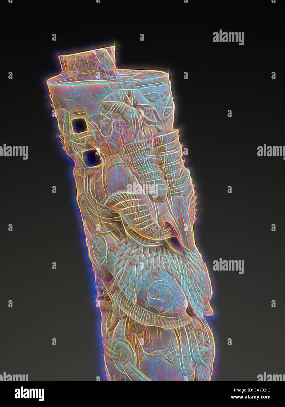 An intricately carved totem features detailed patterns and textures ...