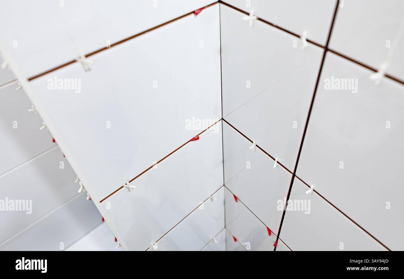 White Ceramic Tiles with Spacers Recently Installed on Wall Stock Photo ...