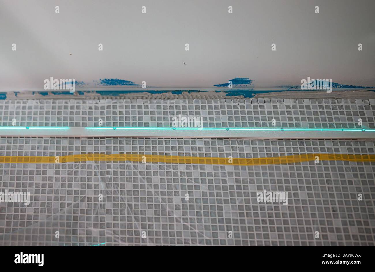 Laser-Guided Ceiling Installation in Progress in Bathroom Stock Photo ...