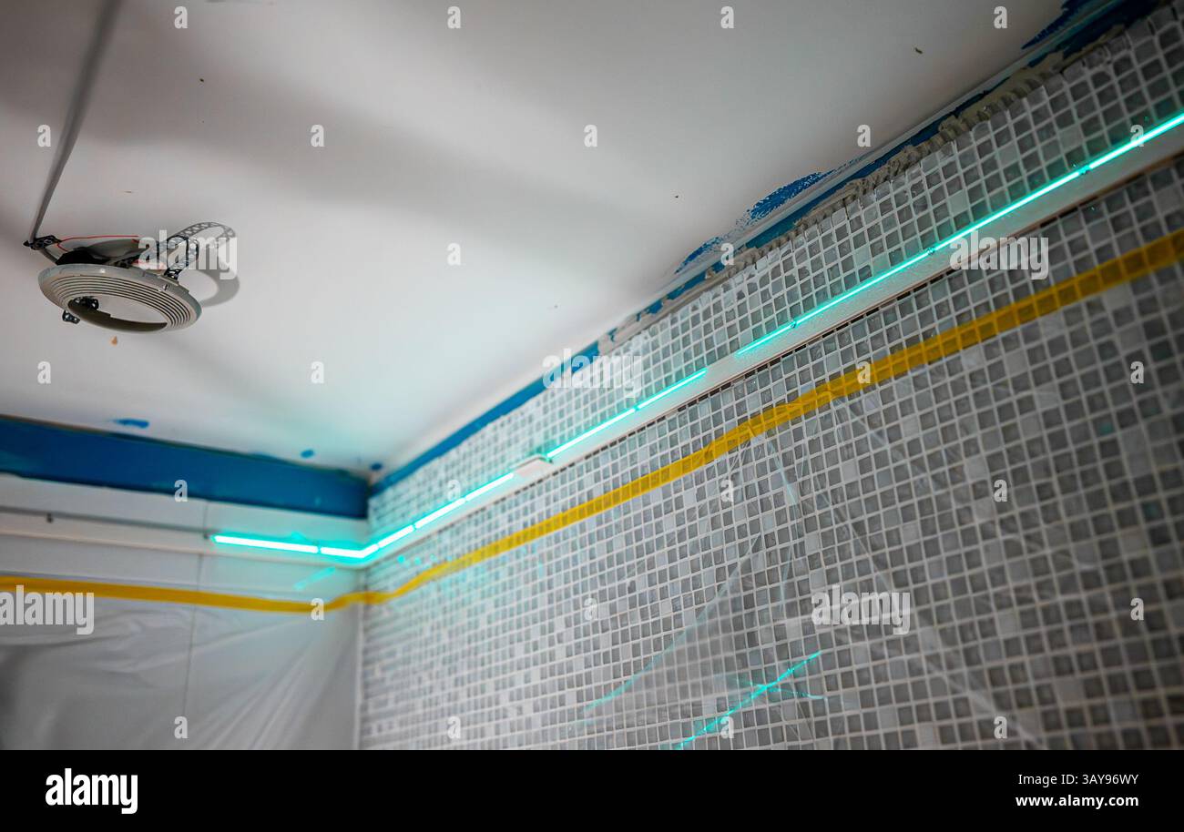 Laser-Guided Ceiling Installation in Progress in Bathroom Stock Photo ...