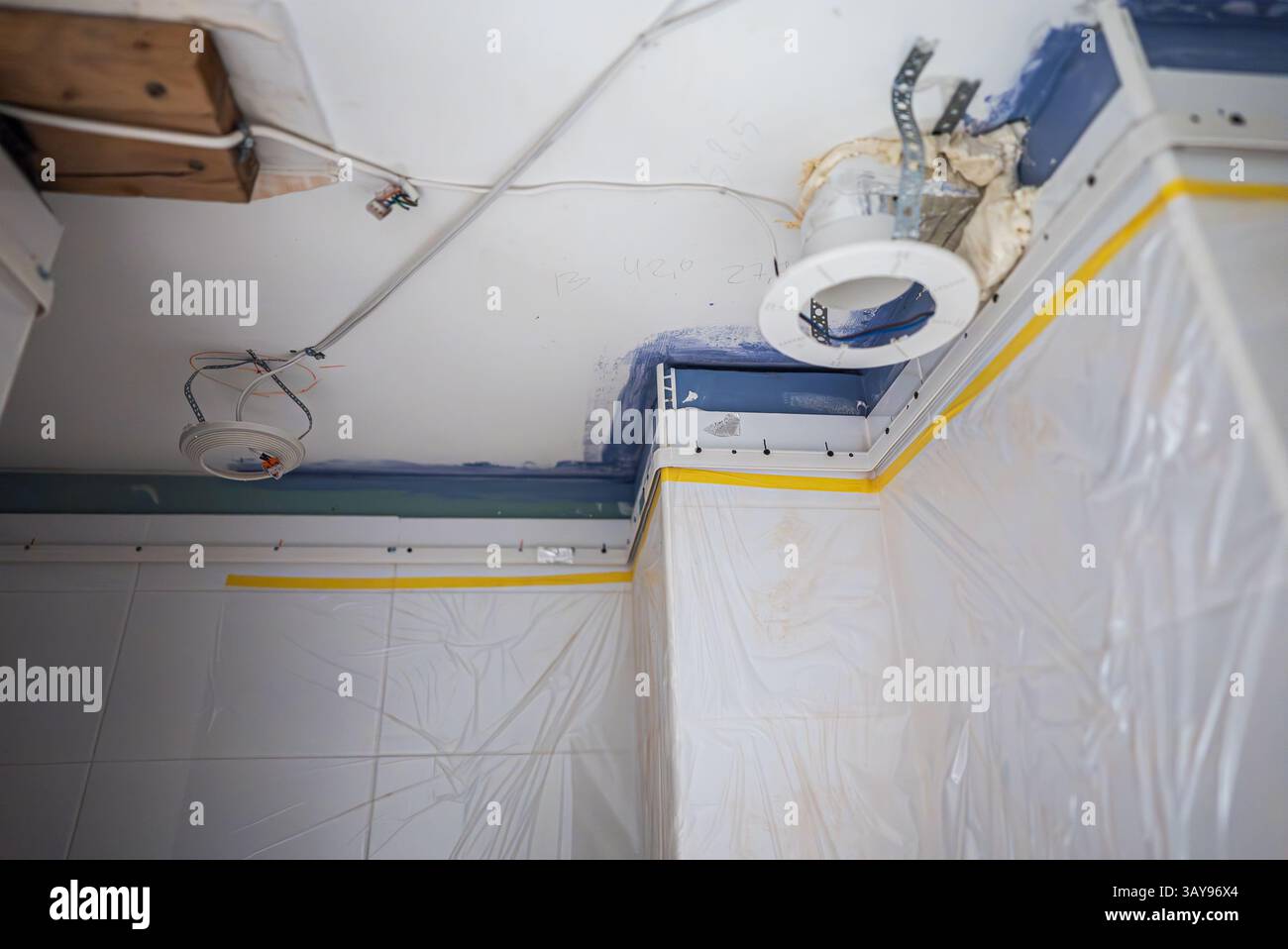 Stretch ceiling Installation in Progress in Bathroom Stock Photo - Alamy
