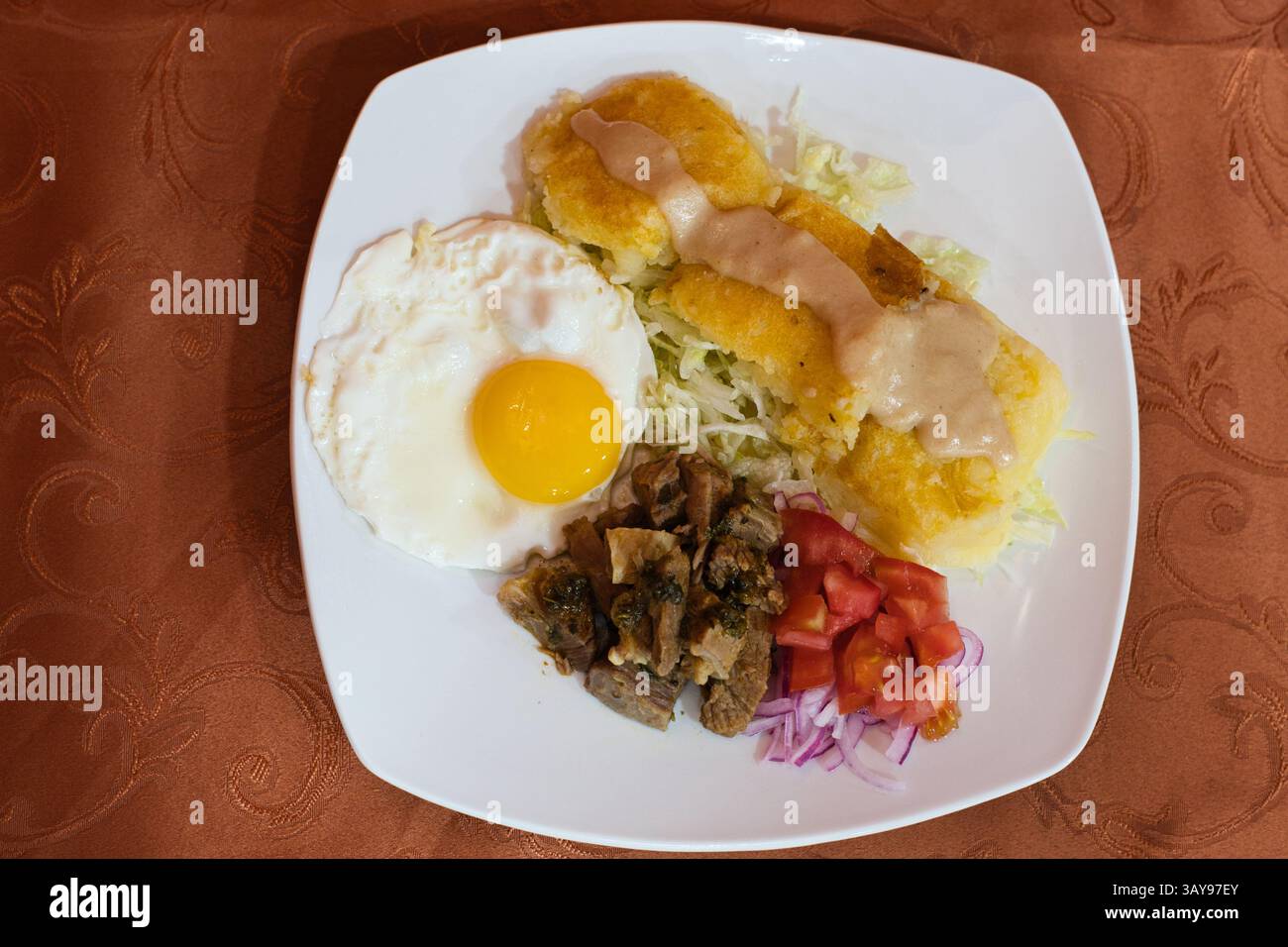 An incredibly hearty breakfast plate featuring delectable eggs, savory ...