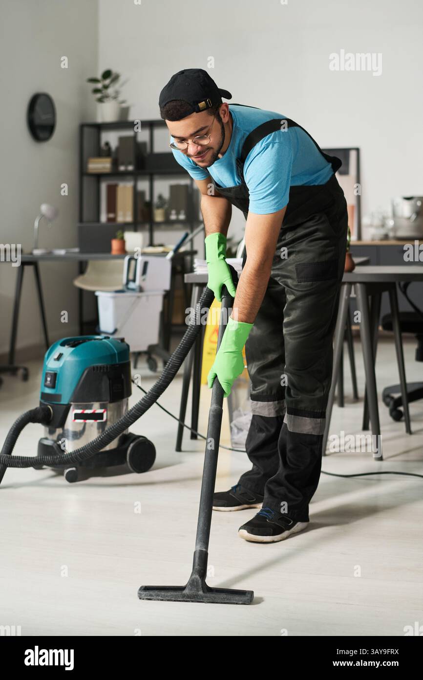 Worker vacuuming floor in hi-res stock photography and images - Alamy