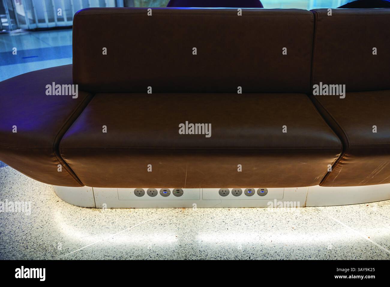 Modern leather bench with built-in electrical and USB outlets at JFK ...