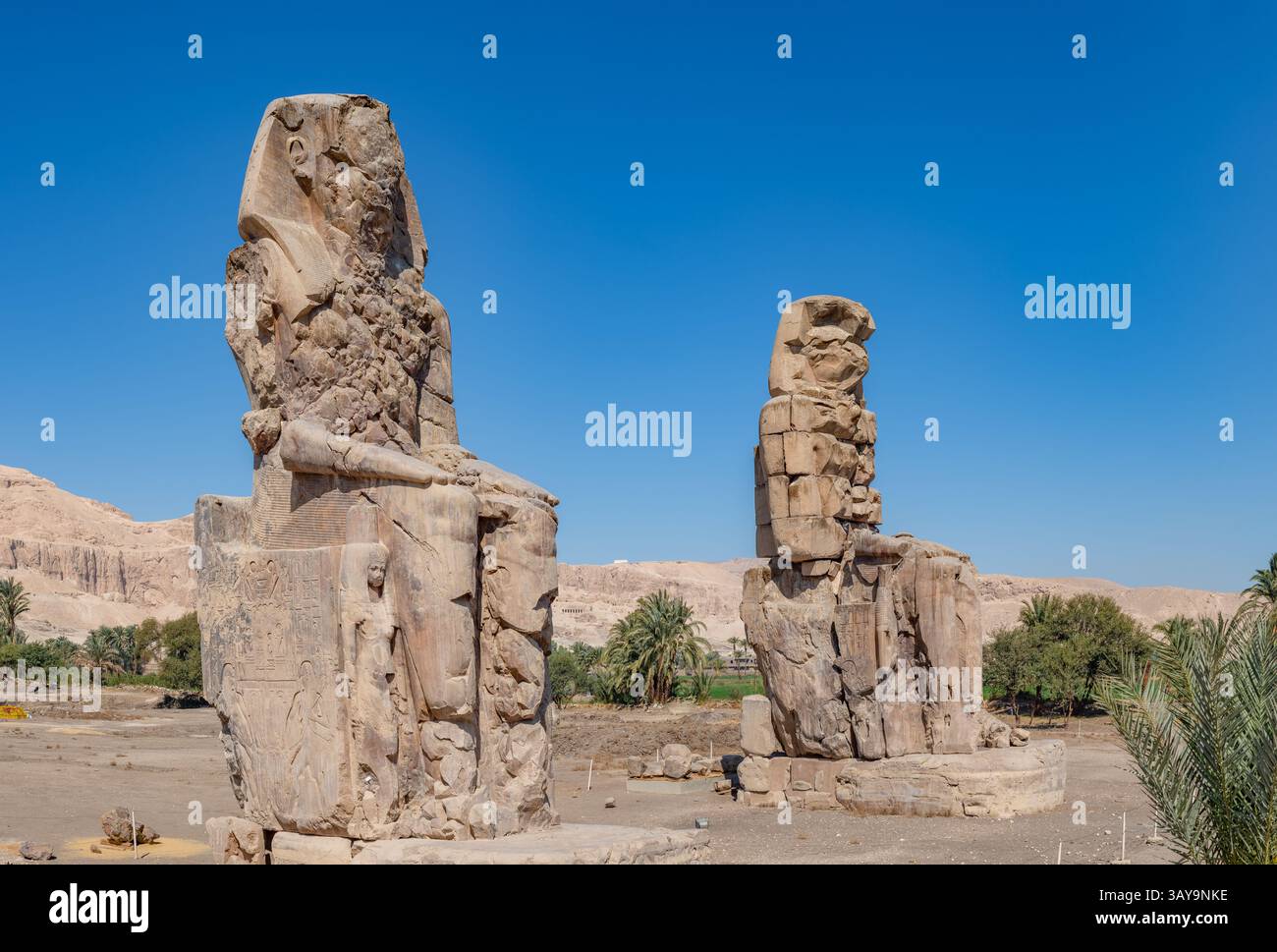 The Colossi of Memnon, two massive stone statues of the Pharaoh ...