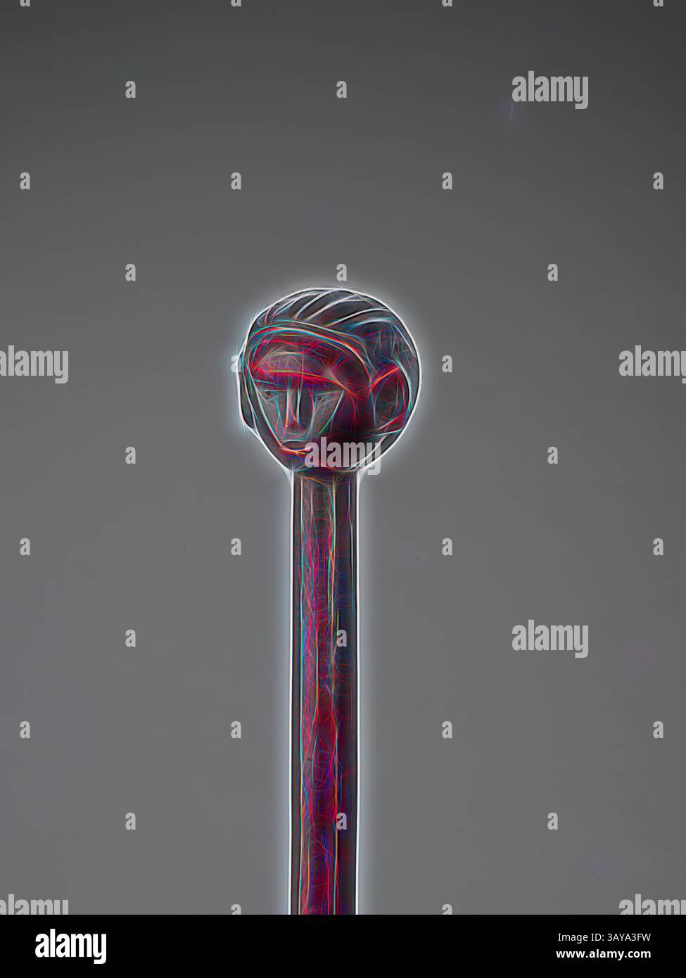 A stylized figure designed with a rounded head and intricate hair ...