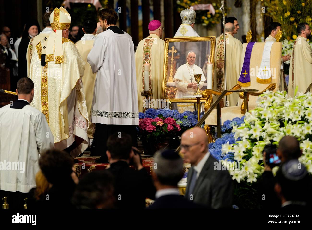 A portrait of Pope Francis is displayed during a mass at St. Patrick's ...