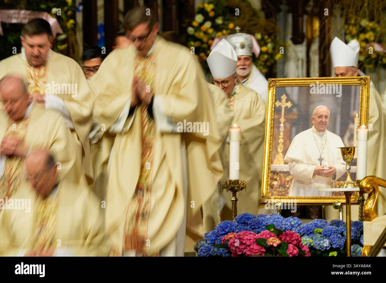 A portrait of Pope Francis is displayed during a mass at St. Patrick's ...