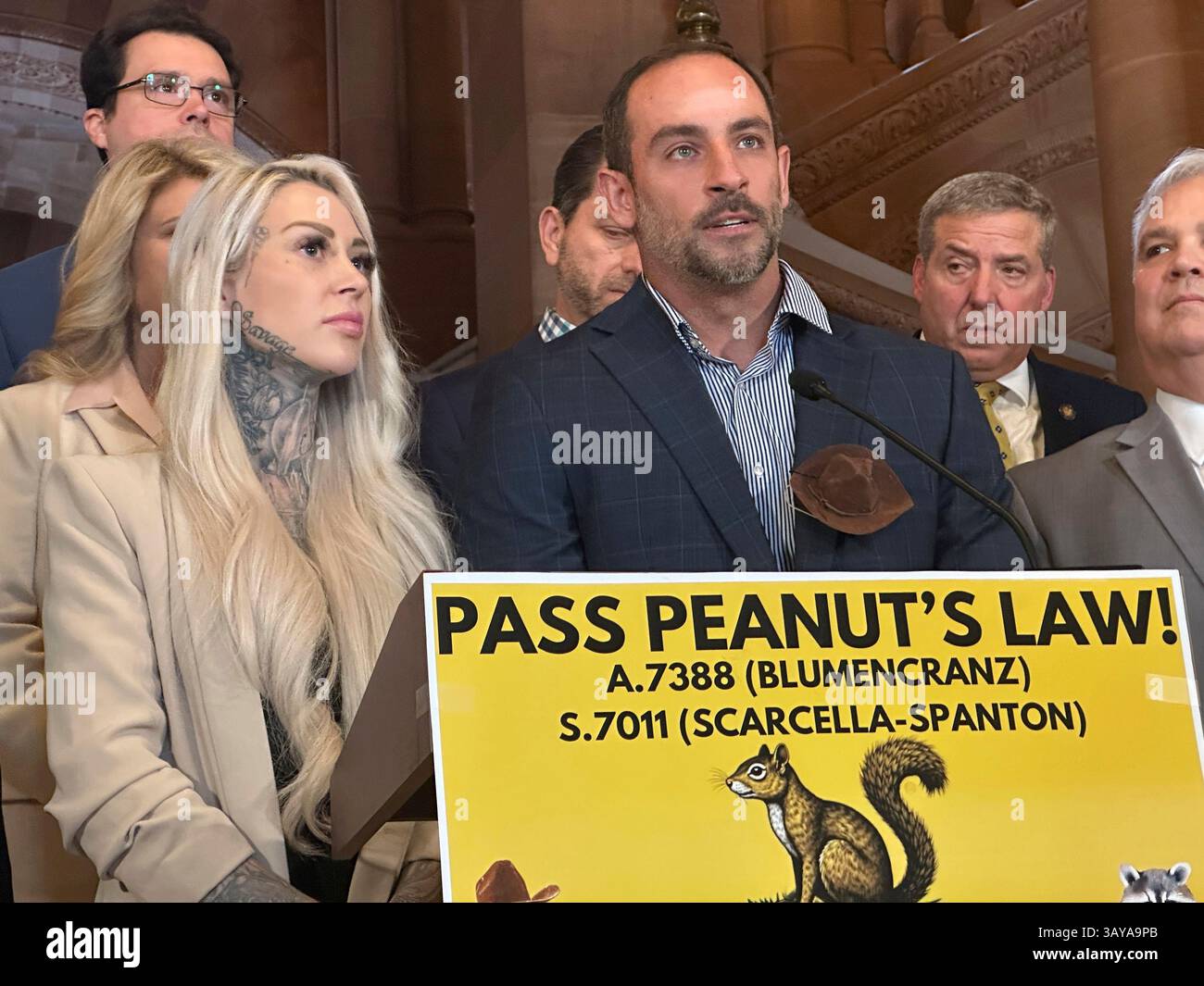 Mark Longo, center, and his wife Daniela Bittner, left, speak during a ...