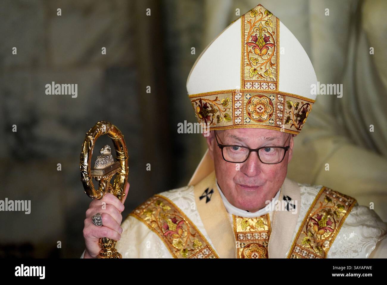 Cardinal Timothy Dolan speaks to reporters following a mass for the ...