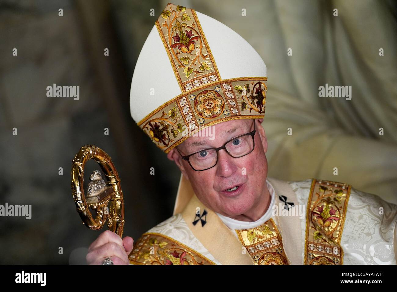 Cardinal Timothy Dolan speaks to reporters following a mass for the ...
