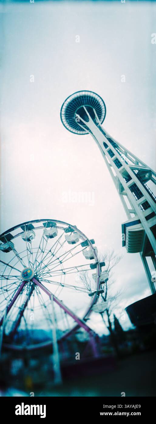 Low angle view of a tower and a ferris wheel, Space Needle, Seattle ...