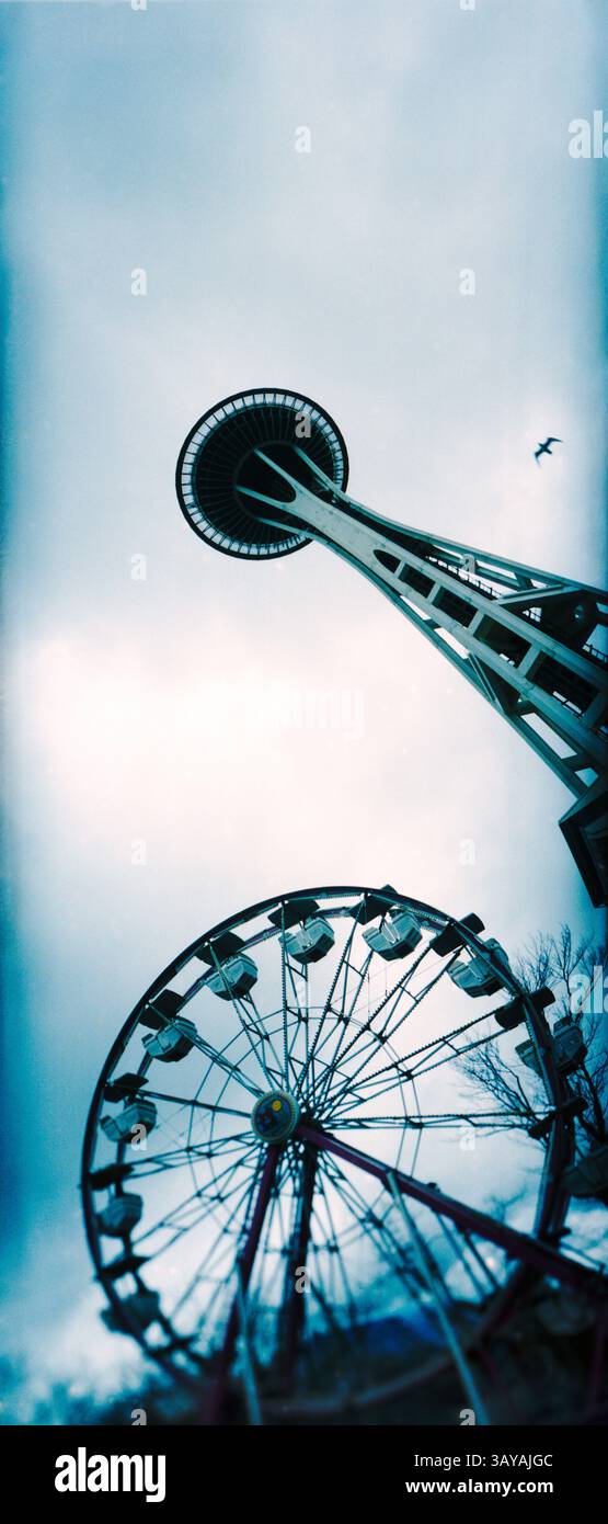 Low angle view of a tower and a ferris wheel, Space Needle, Seattle ...