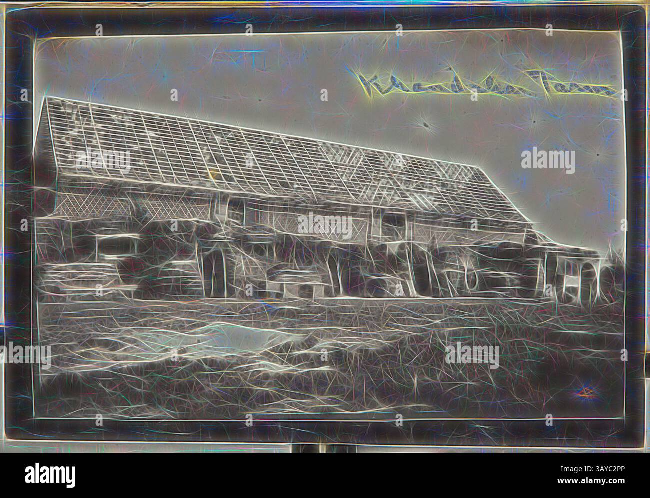 An old barn with a sloped roof stands weathered and rustic, surrounded ...